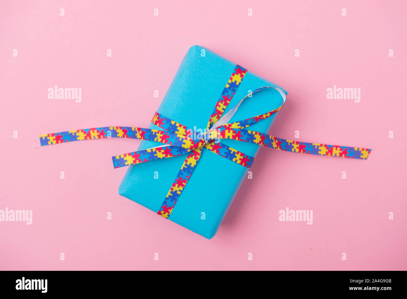 World Autism awareness blue background with gift on pink background ...