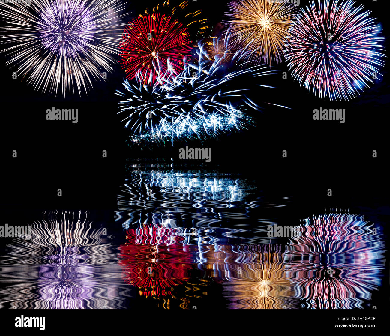 Fireworks with reflection. Holiday celebration Stock Photo - Alamy