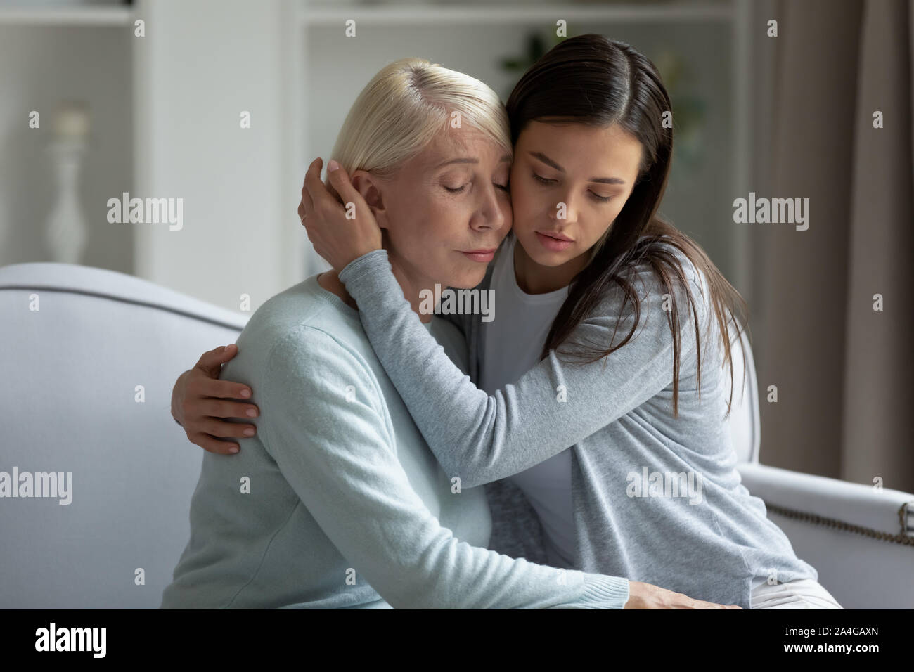 Millennial upset lady calming soothing depressed middle aged mother ...