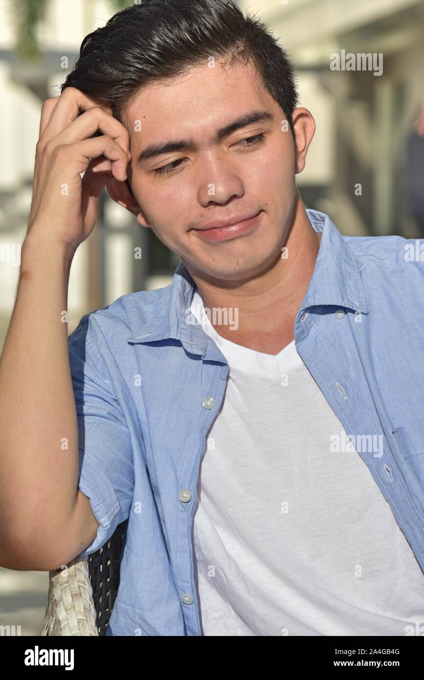 Young Filipino Male Deciding Stock Photo - Alamy