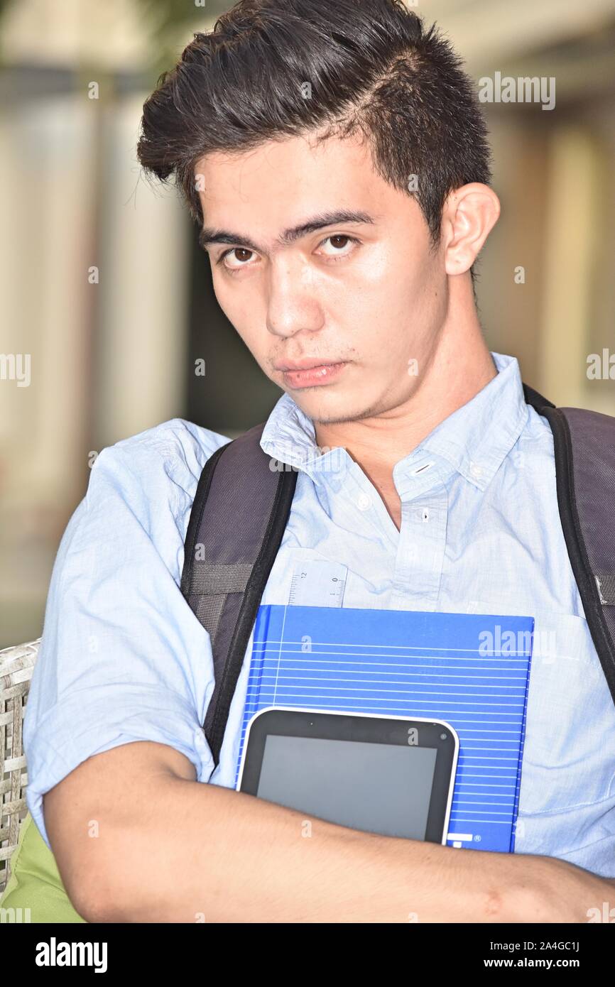 Serious Youthful Student With Notebooks Stock Photo - Alamy
