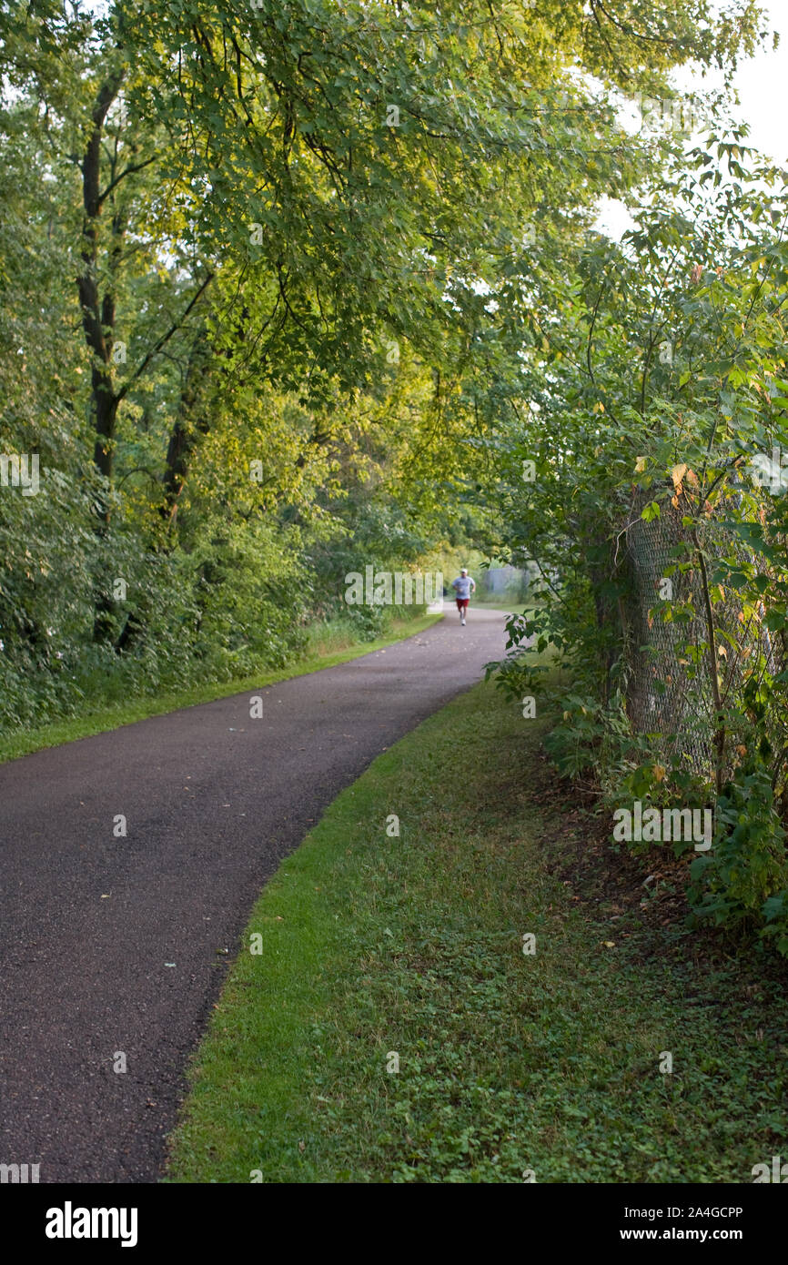 Man jogging along footpath Stock Photo - Alamy