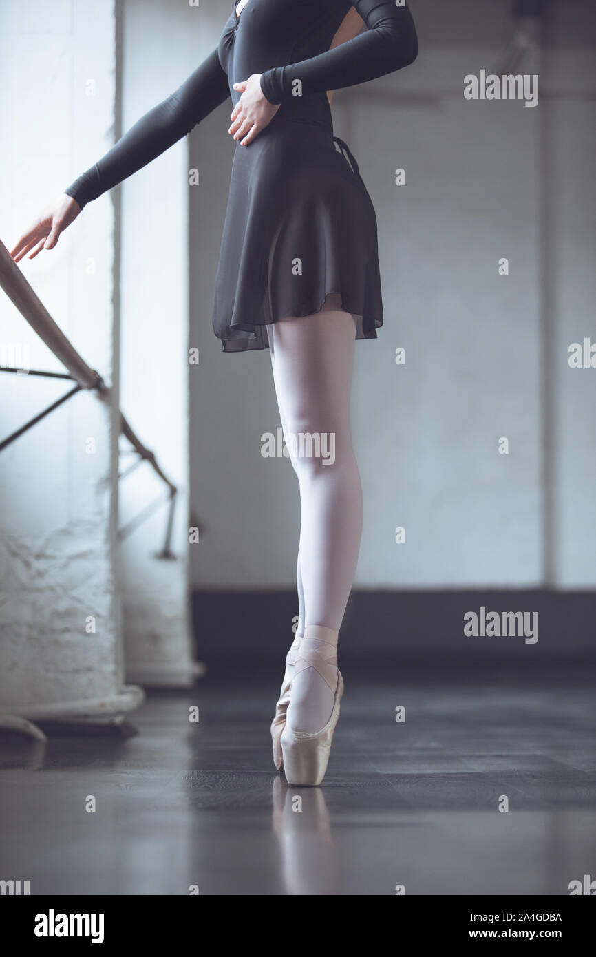 Young ballet dancer standing on toes in studio active lifestyle Stock ...