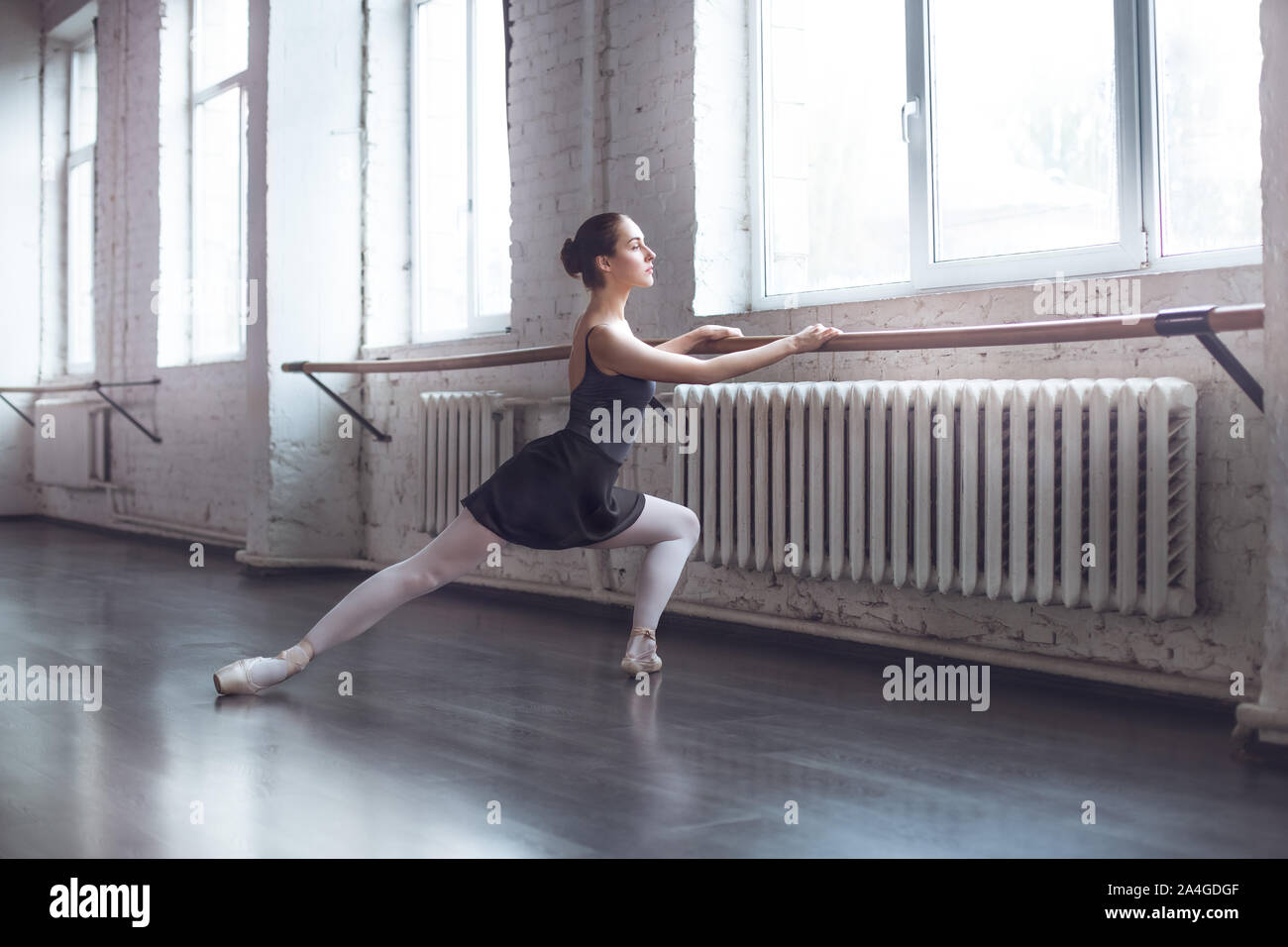 Young ballet dancer legs stretching in studio active lifestyle Stock ...