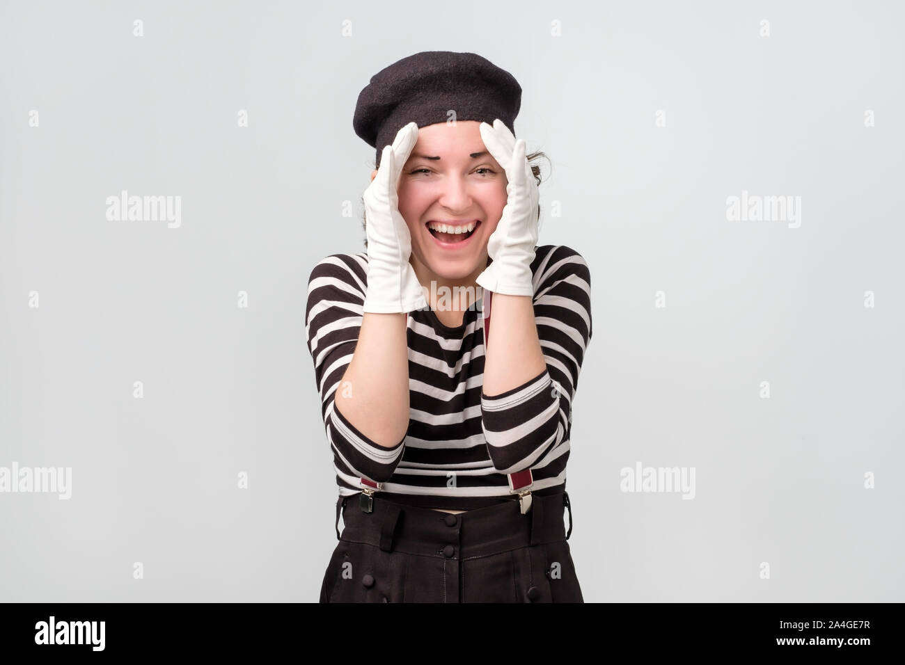 Pretty mime woman is excited with great news Stock Photo - Alamy