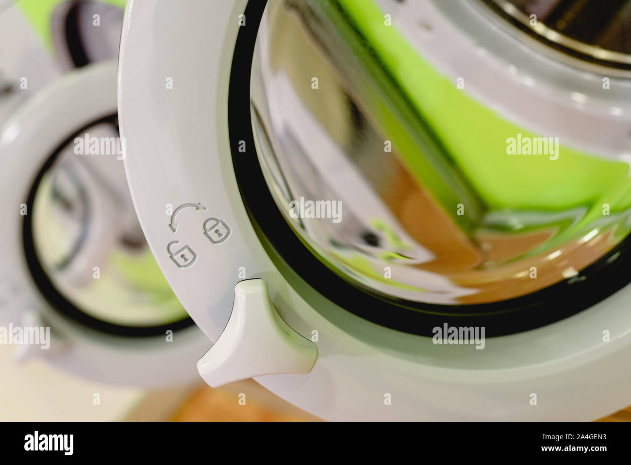 Open doors of industrial washing machines in a public laundry, door ...