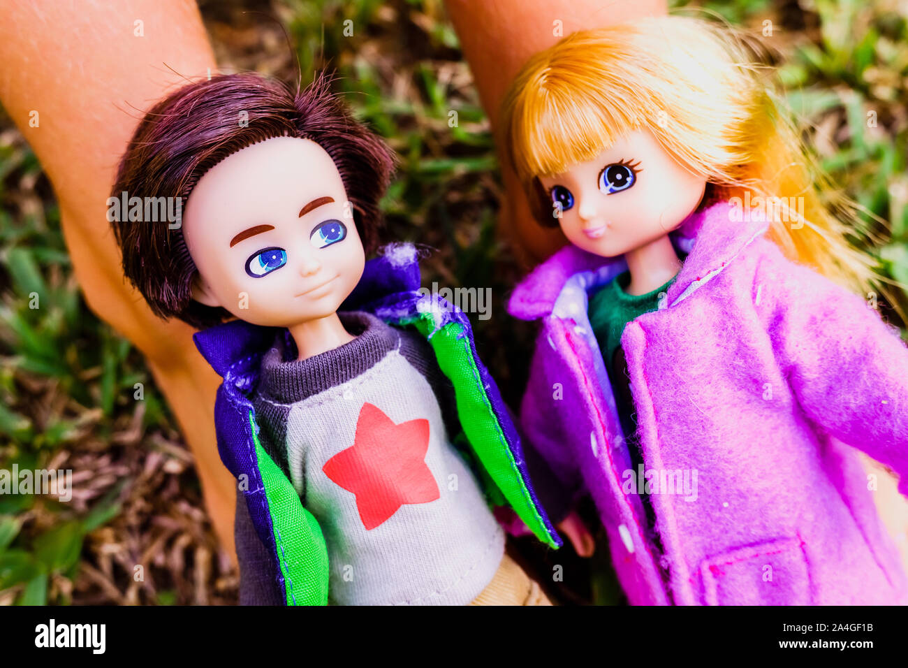 Girl playing with dolls without gender bias or negative stereotypes ...