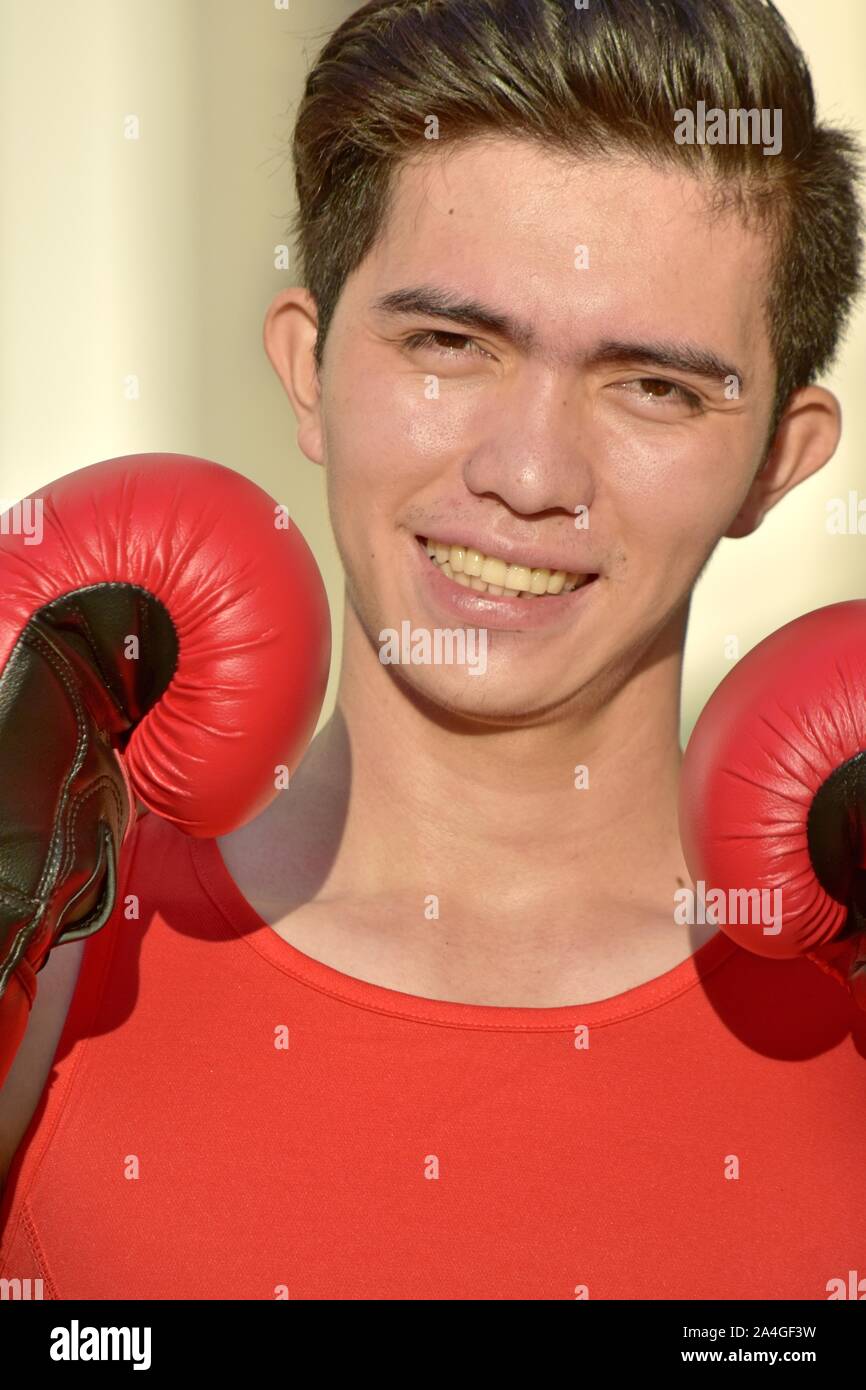 Fit Filipino Male Athlete Smiling Wearing Boxing Gloves Stock Photo - Alamy