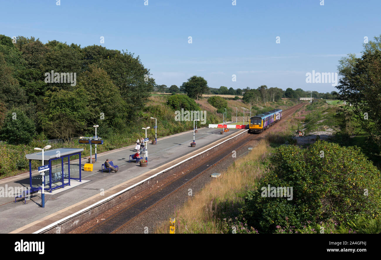 2 Arriva Northern rail class 142 pacer trains arriving at at Daisy Hill railway station ...