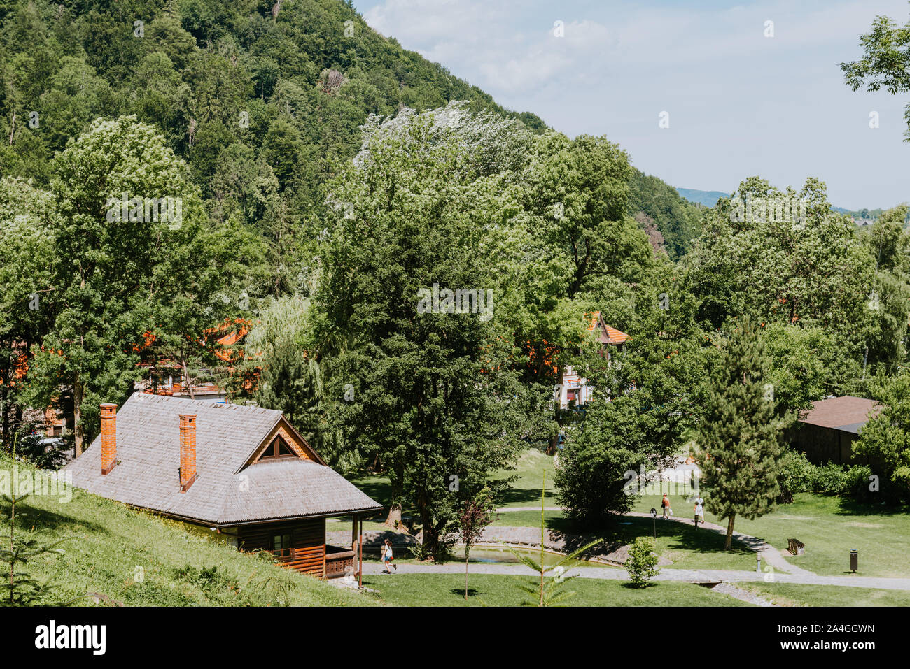 Rural landscape with lush green fields and farm house Stock Photo - Alamy