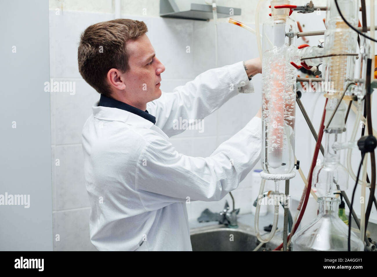 scientist conducts chemical experiments with liquids in the medical ...