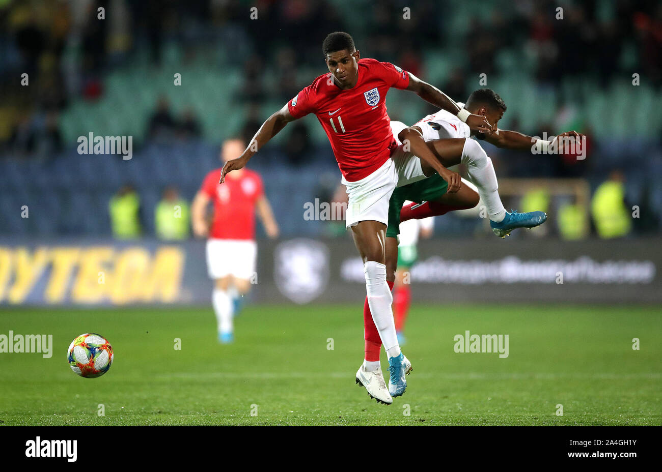 England's Marcus Rashford (left) and Bulgaria's Georgi Pashov (right ...