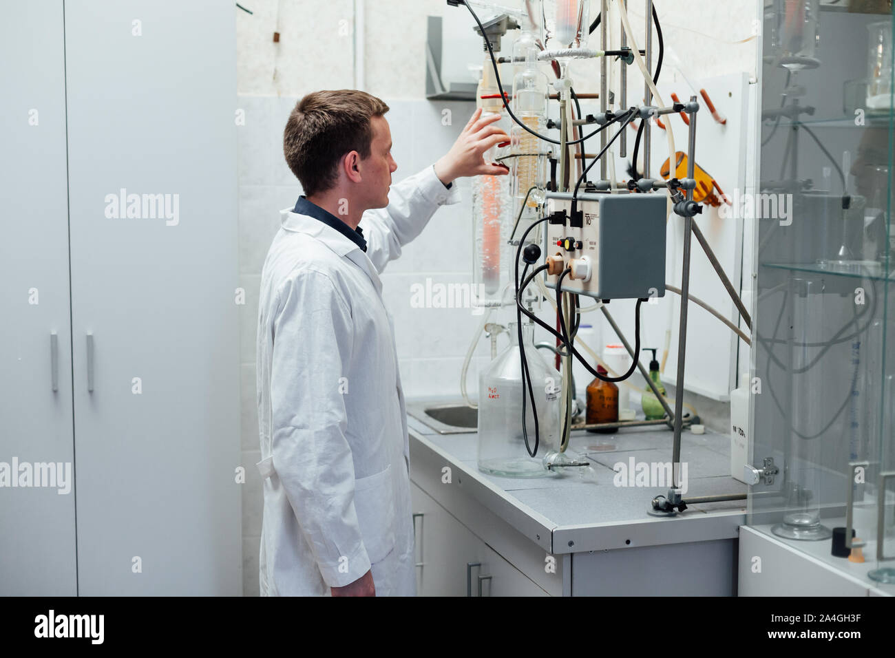scientist conducts chemical experiments with liquids in the medical ...