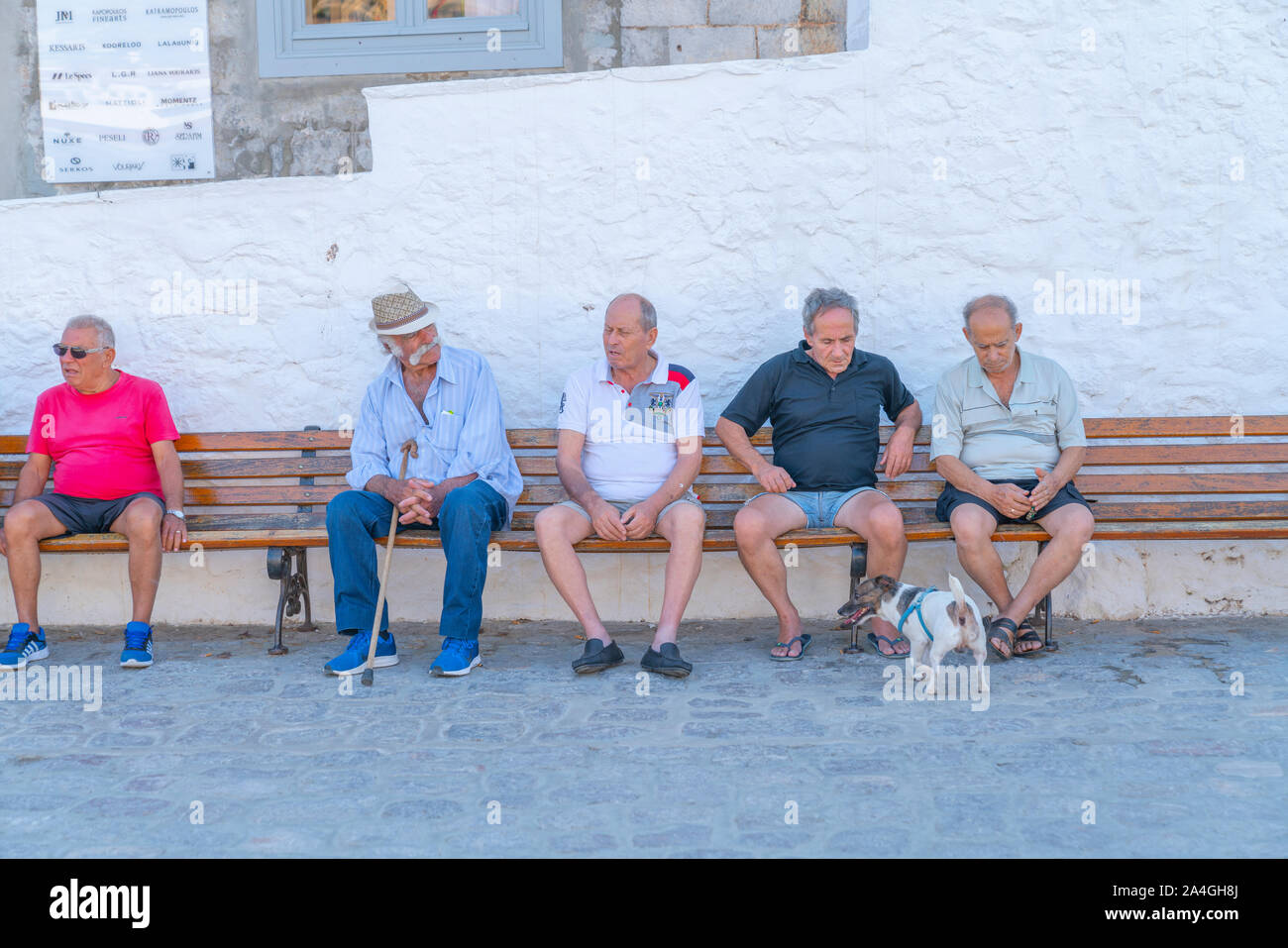 Hydra, Greece - July 20 2019; Greek men doing what men have done ...