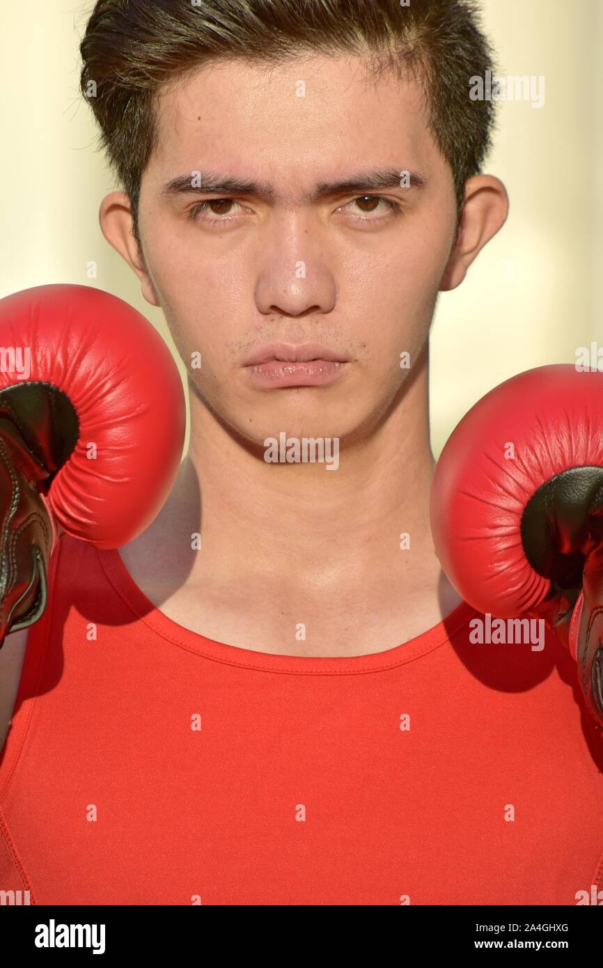 Man wearing boxing gloves hi-res stock photography and images - Alamy