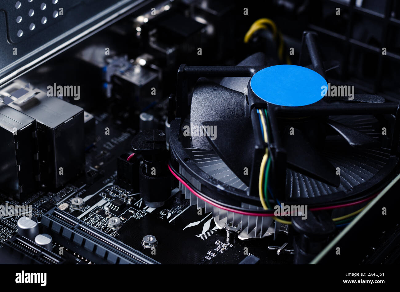 Close up photo with motherboard of computer and its fan Stock Photo - Alamy