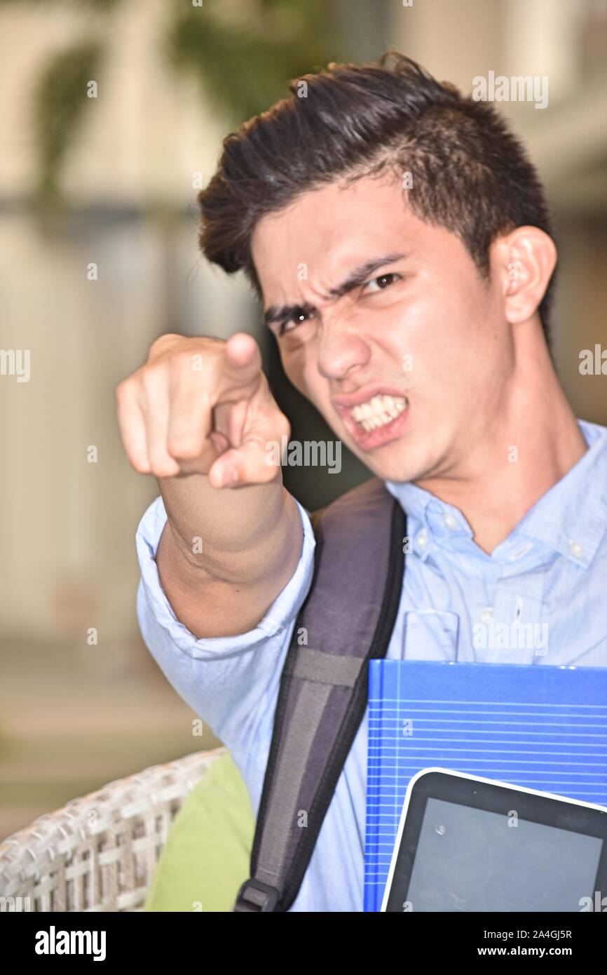 Male student pointing school hi-res stock photography and images - Alamy