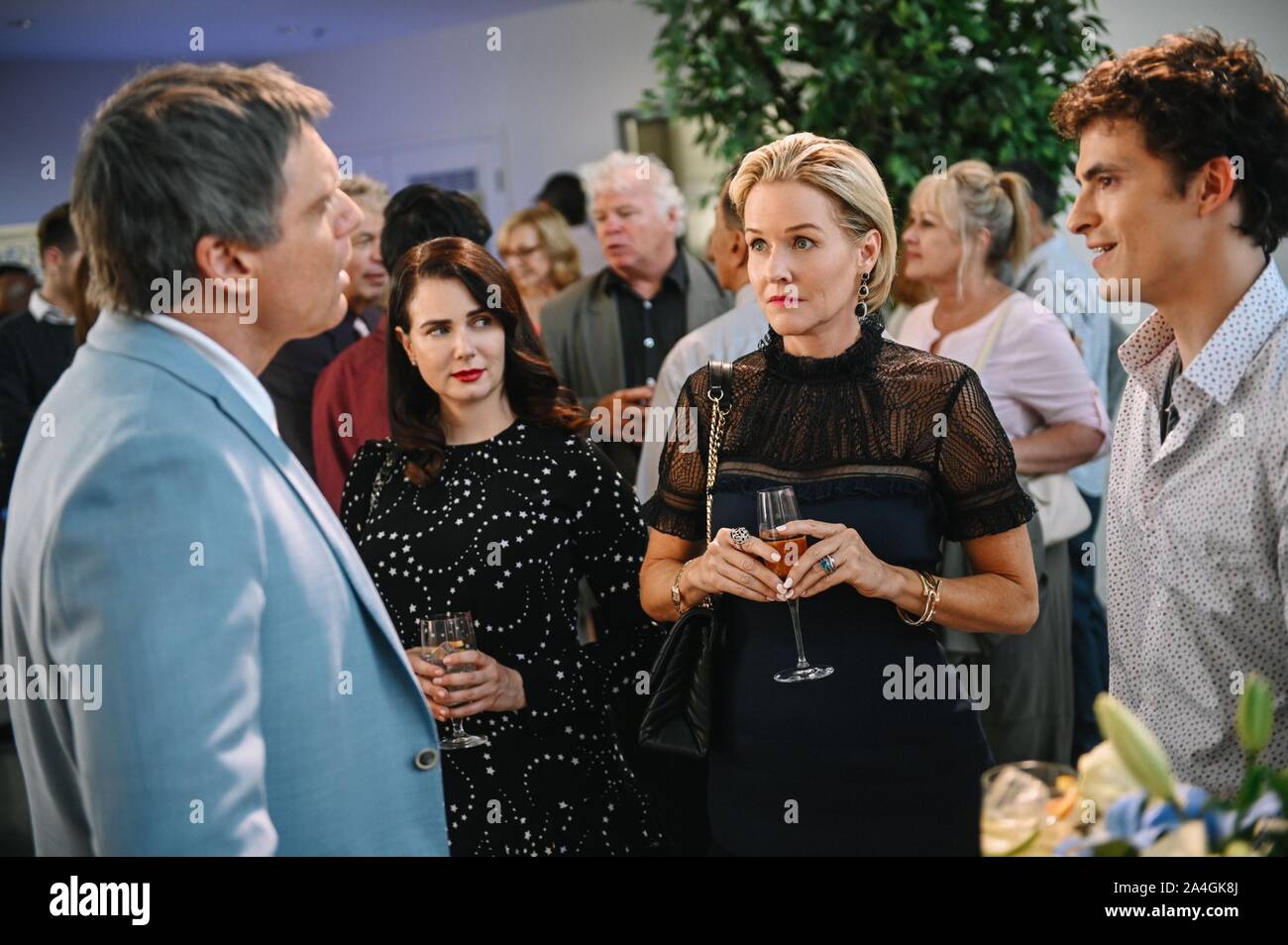 THE COLLEGE ADMISSIONS SCANDAL, from left: Michael Shanks, Mia Kirshner ...