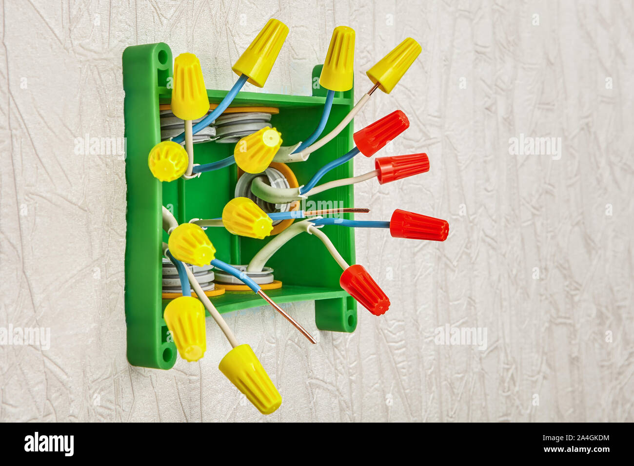 Screw-nut connection of electrical wire in home wiring. Installation of ...