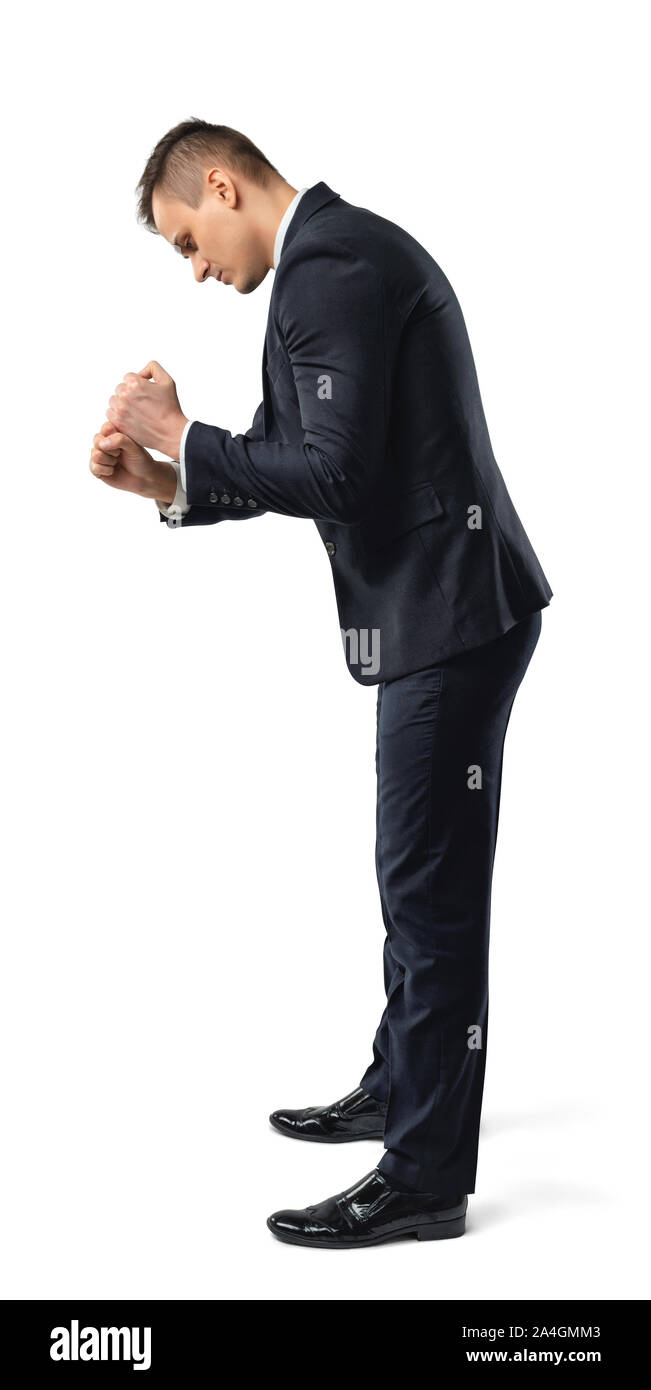 Side view of a businessman carrying invisible sack, isolated on white ...