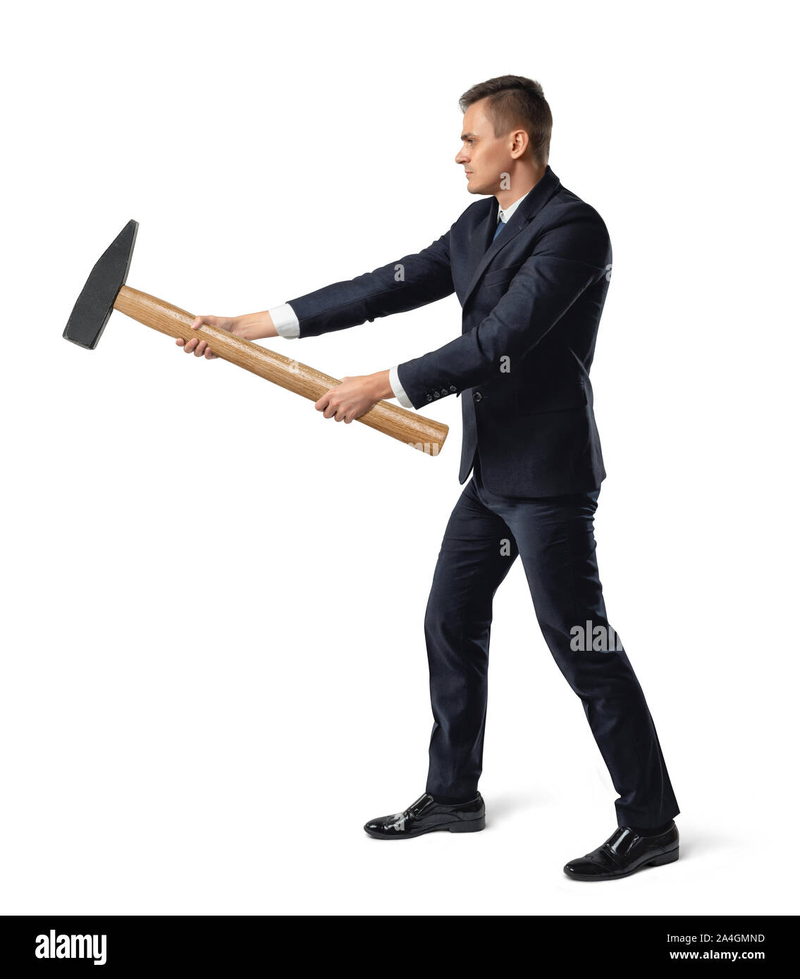 Side view of businessman with big hammer in his arms destroying ...