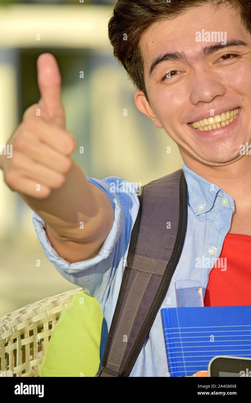 Student With Thumbs Up Stock Photo - Alamy