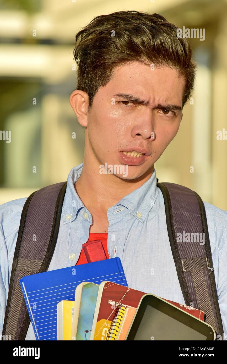 Young Asian Male Student And Confusion With Notebooks Stock Photo - Alamy