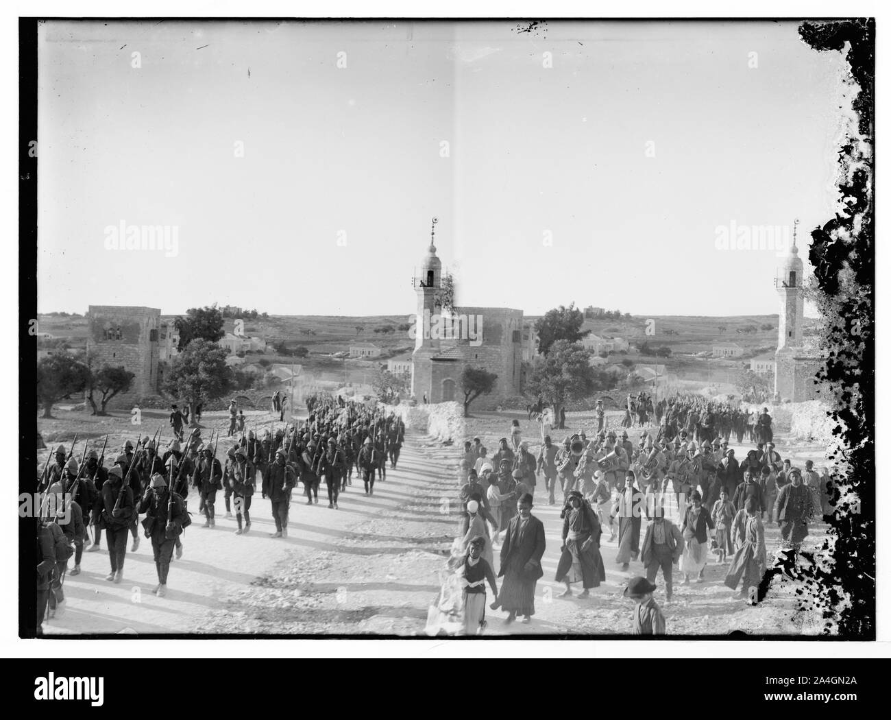 Turkish soldiers marching past Am. [i.e., American] Colony on Nablus ...