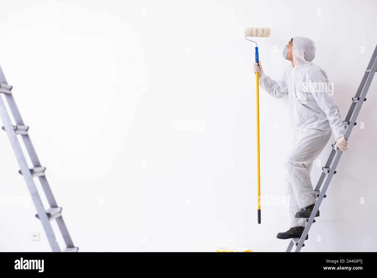 Painter working at the construction site Stock Photo - Alamy