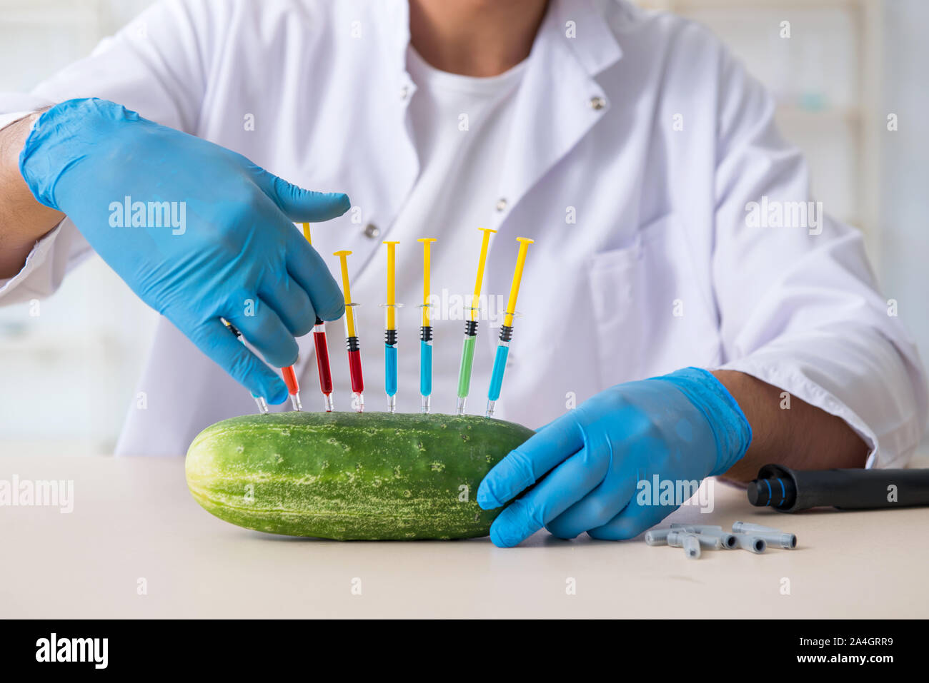 The male nutrition expert testing vegetables in lab Stock Photo - Alamy