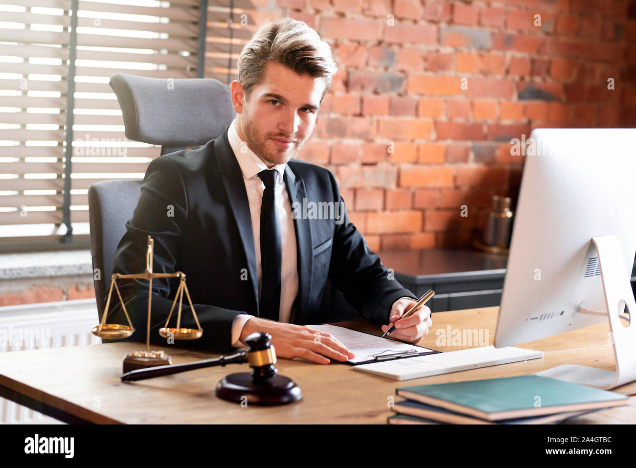 Lawyer or attorney working in office. Law and justice concept Stock ...