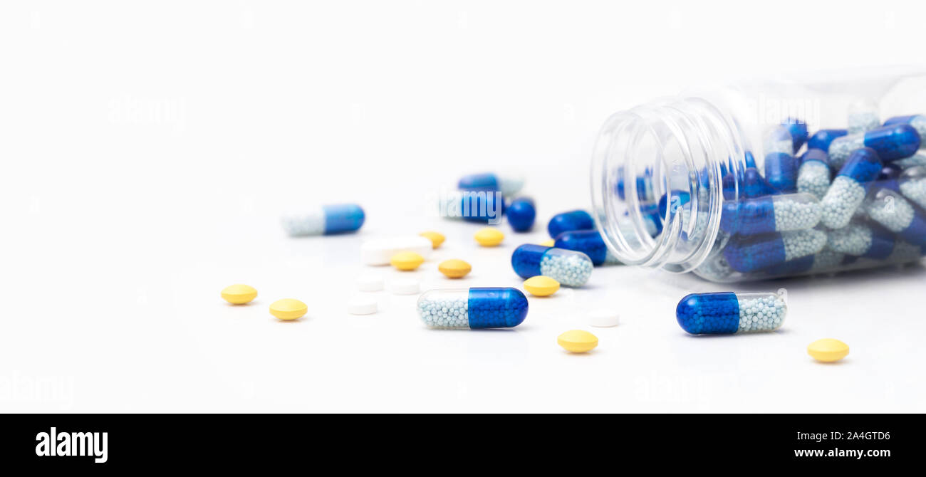 Pile of spilled capsules on a white background. Pharmacy concept Stock ...