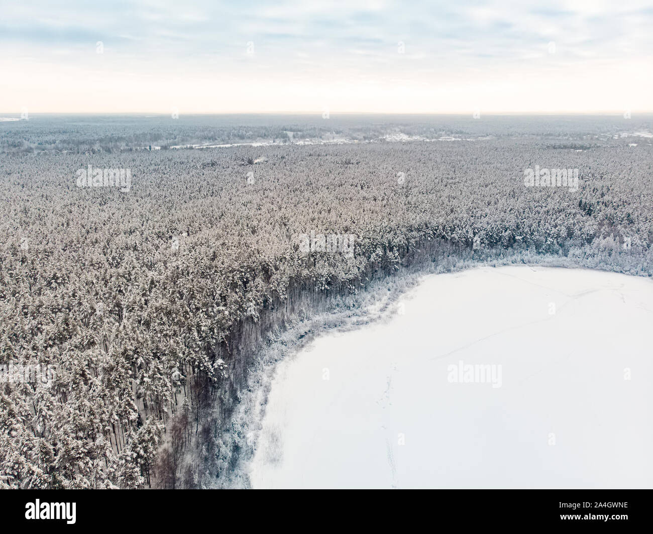 Beautiful aerial view of snow covered pine forests aroung Gela lake ...