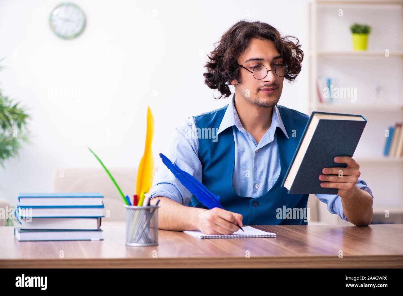 The young writer working on his new work Stock Photo - Alamy