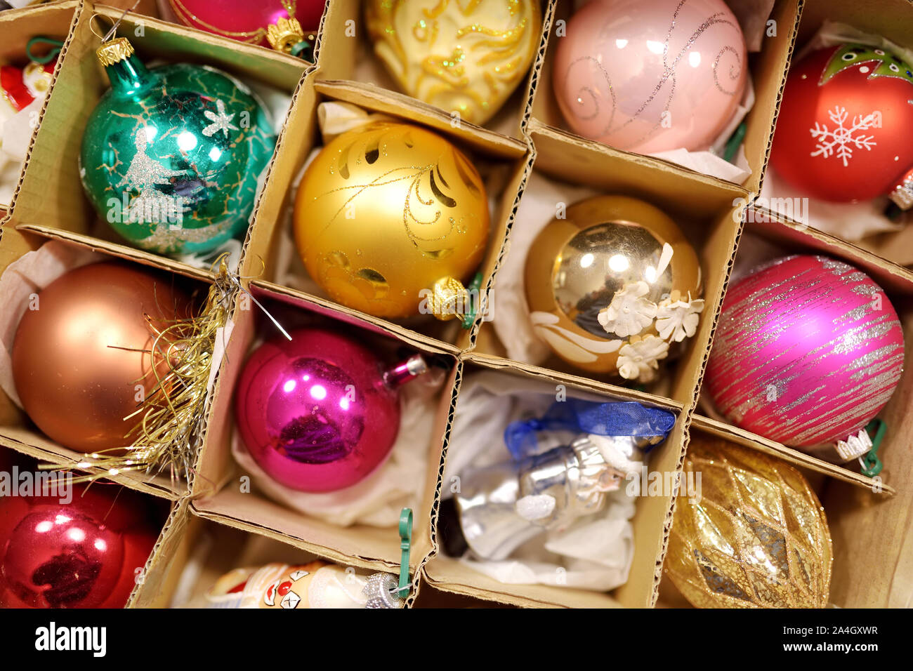 Variety of colorful Christmas baubles in a boxes. Trimming the ...