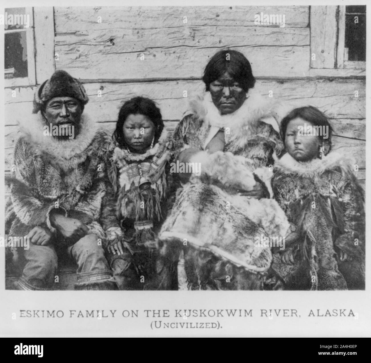 Two Eskimo families in front of houses on the Kuskokwim River, Alaska ...