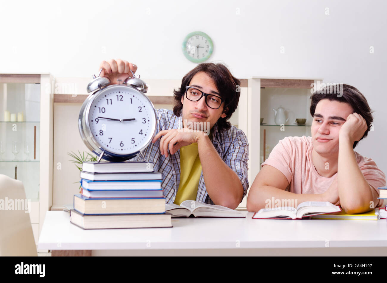 The two male students preparing for exams at home Stock Photo - Alamy