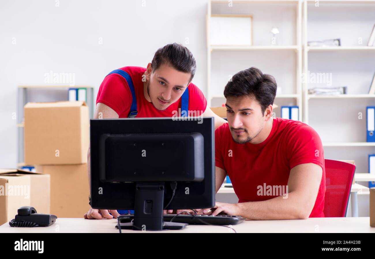 The two contractor employees moving personal belongings Stock Photo - Alamy