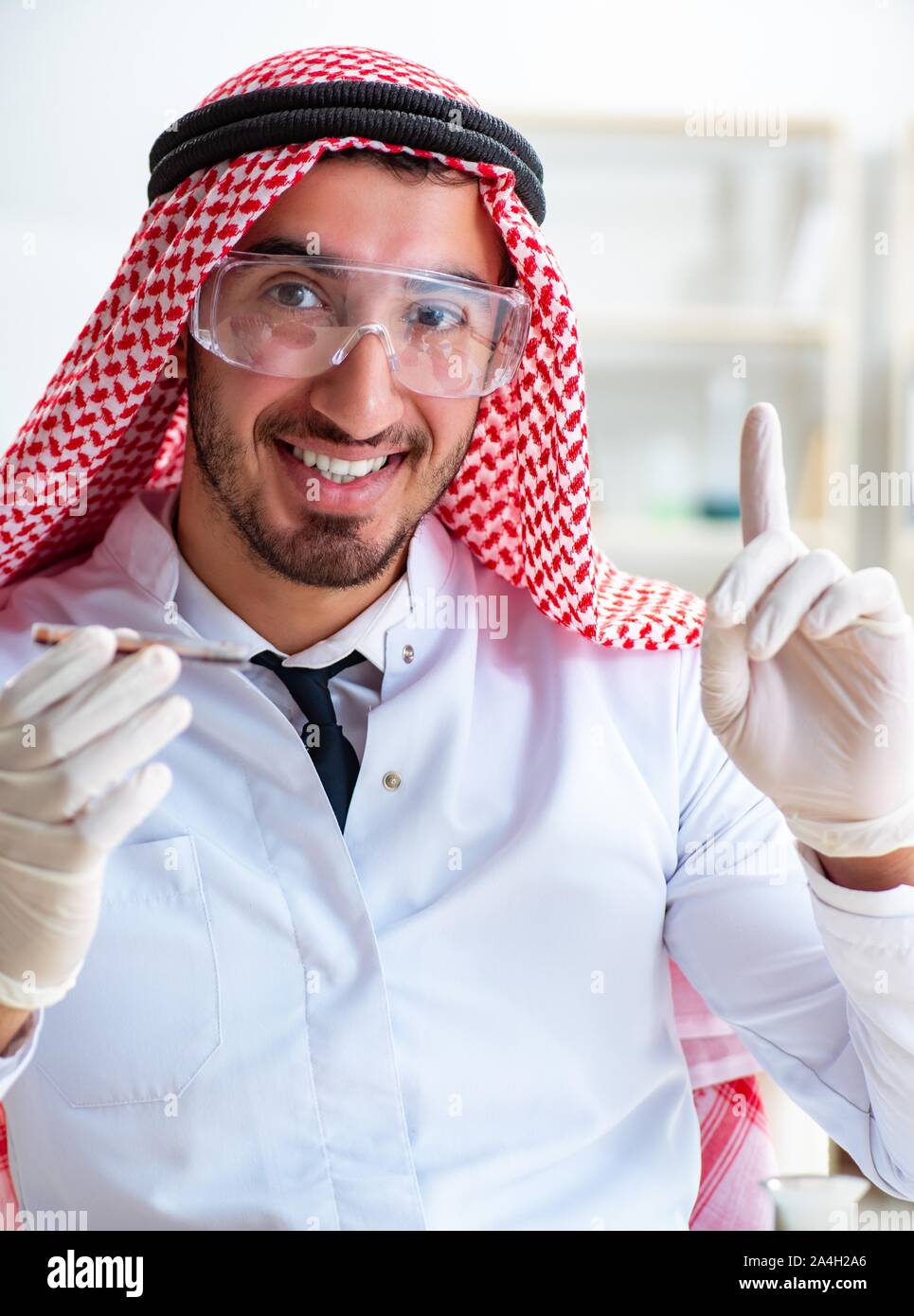 The arab chemist scientist testing quality of oil petrol Stock Photo ...