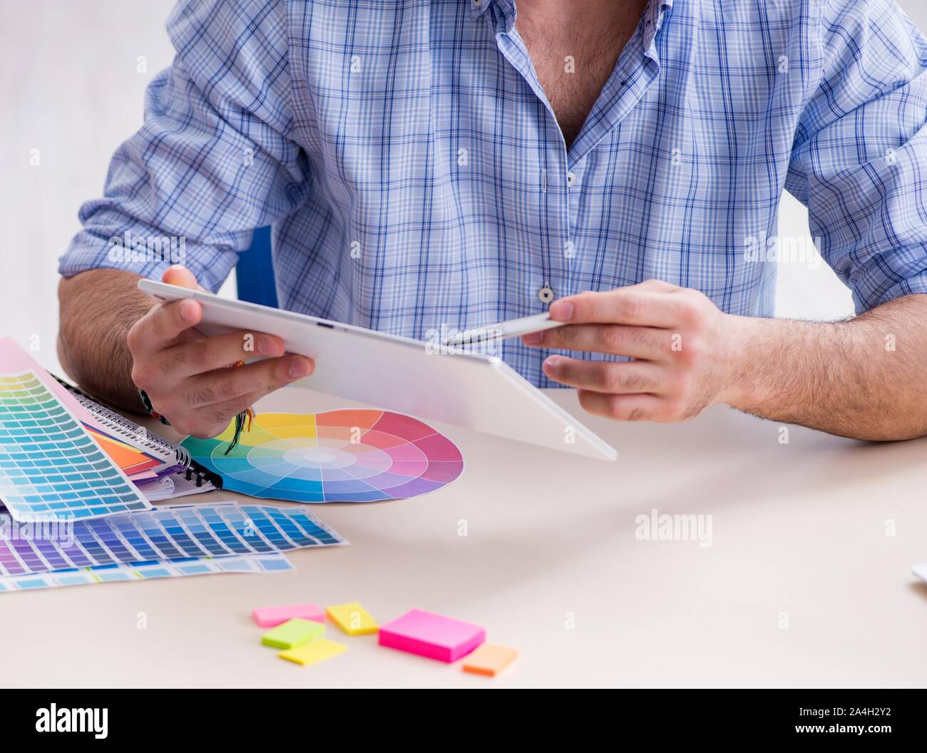 The young designer working in his studio on new project Stock Photo - Alamy