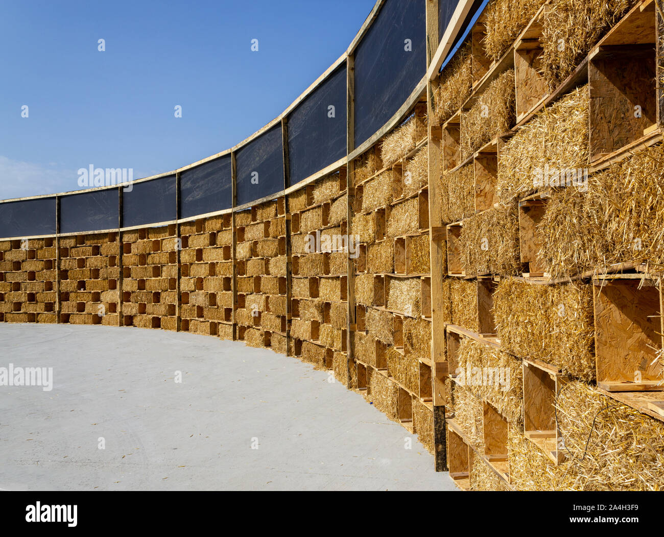 Hay bales isolated background wall Stock Photo - Alamy