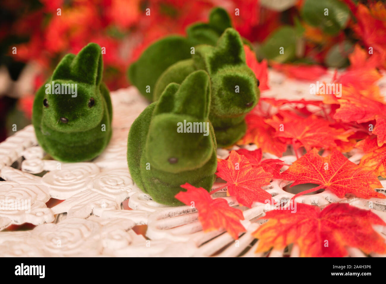 green grass decoration Rabbits on white retro table in the autumn ...