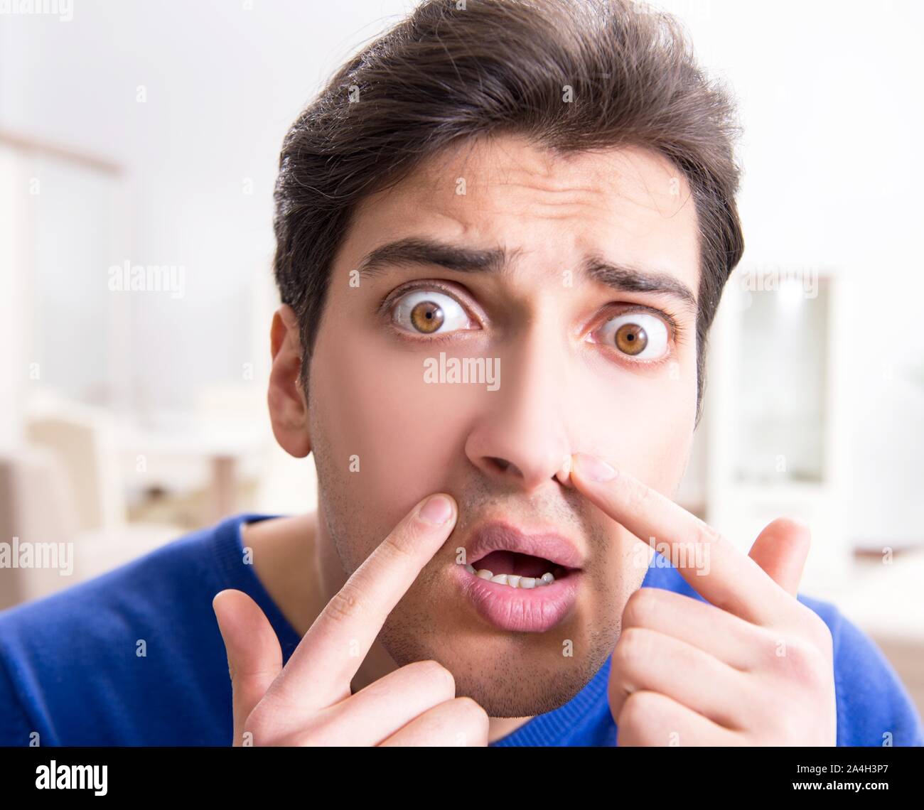 Shocked young man panicking hi-res stock photography and images - Alamy