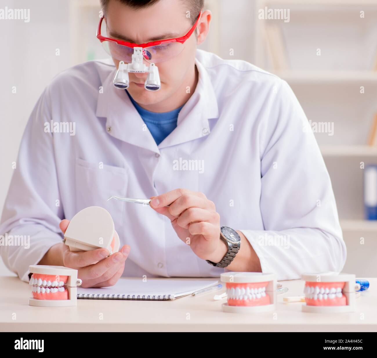 The dentist working teeth implant in medical lab Stock Photo - Alamy