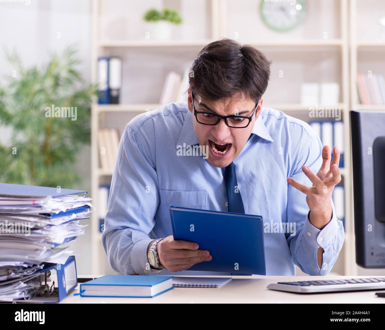 The tired businessman with too much paperwork Stock Photo - Alamy