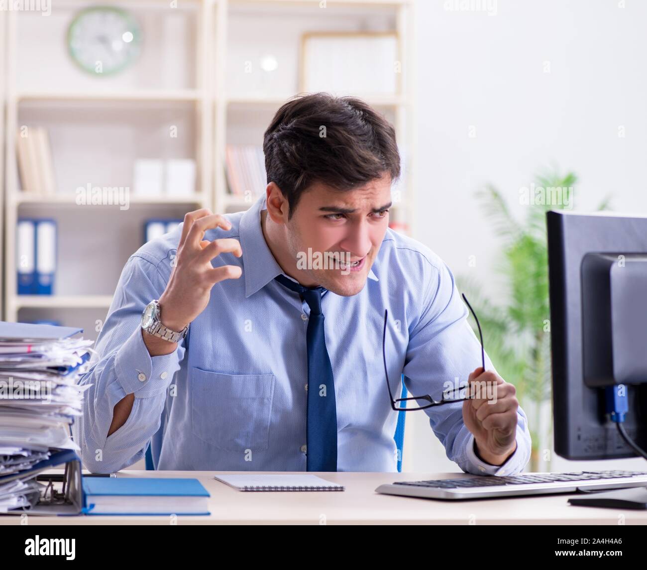 The tired businessman with too much paperwork Stock Photo - Alamy