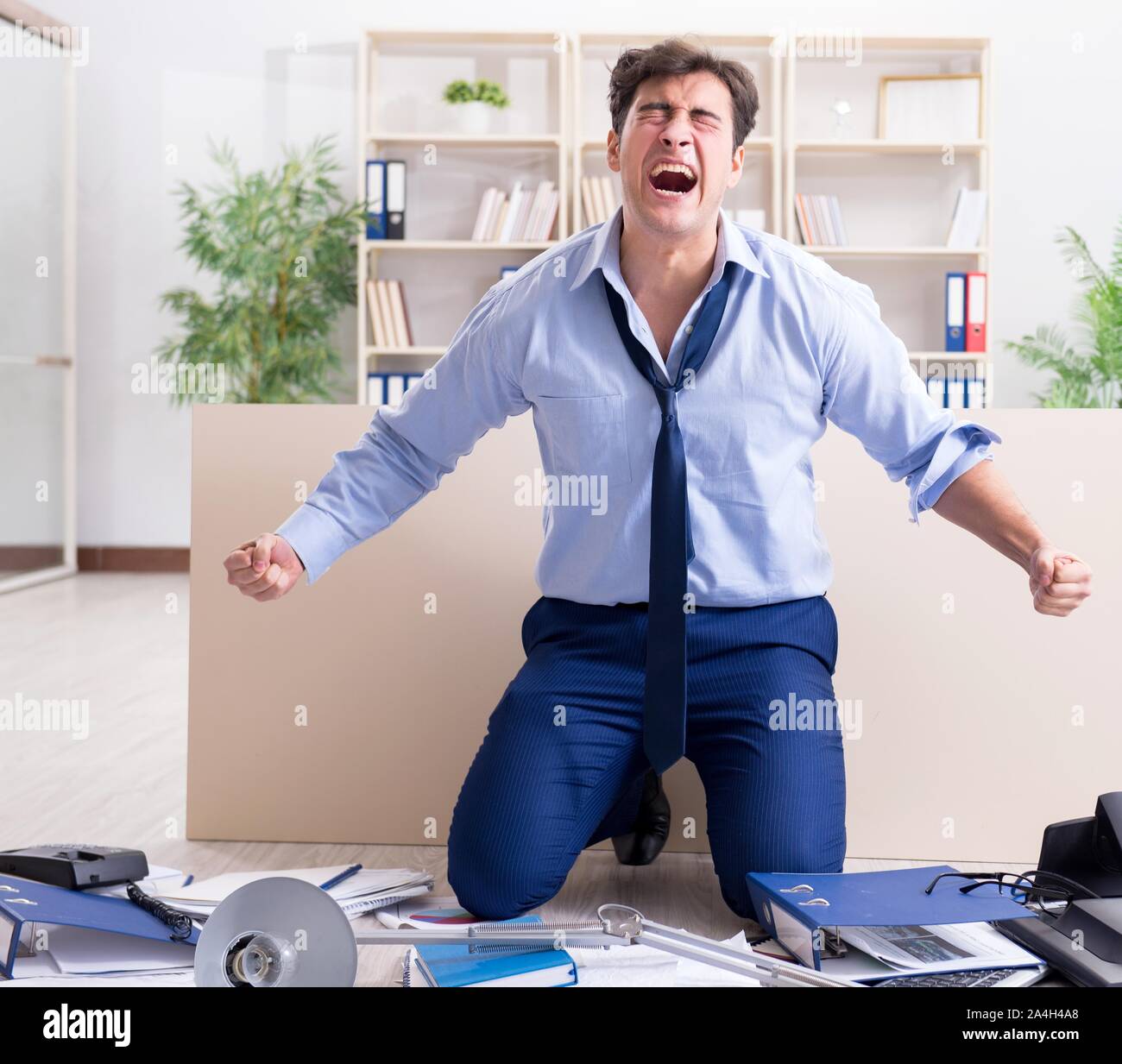 The angry businessman frustrated with too much work Stock Photo - Alamy