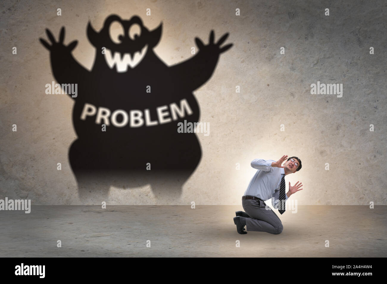 Businessman afraid of the big problem Stock Photo - Alamy
