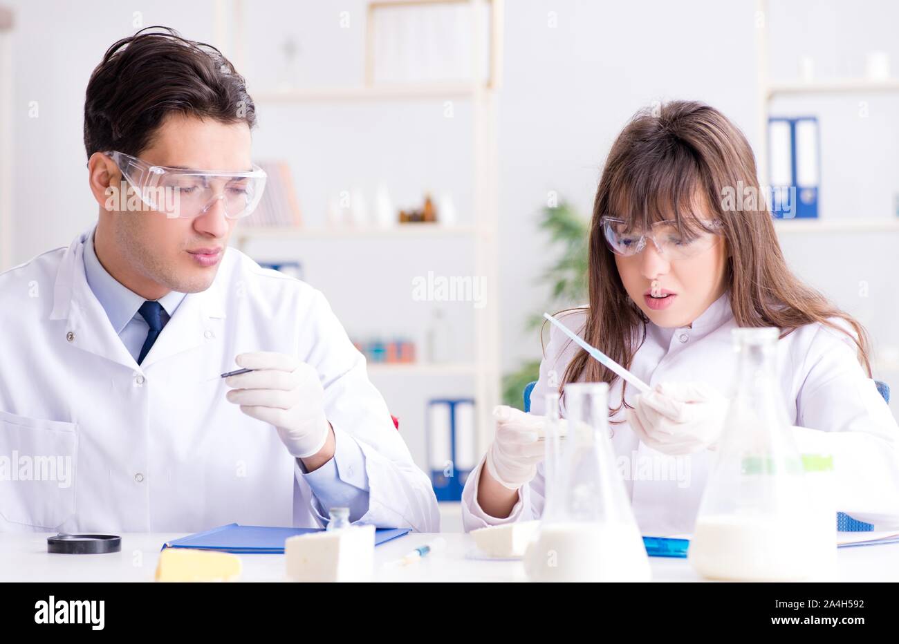Two lab doctor testing food products Stock Photo - Alamy