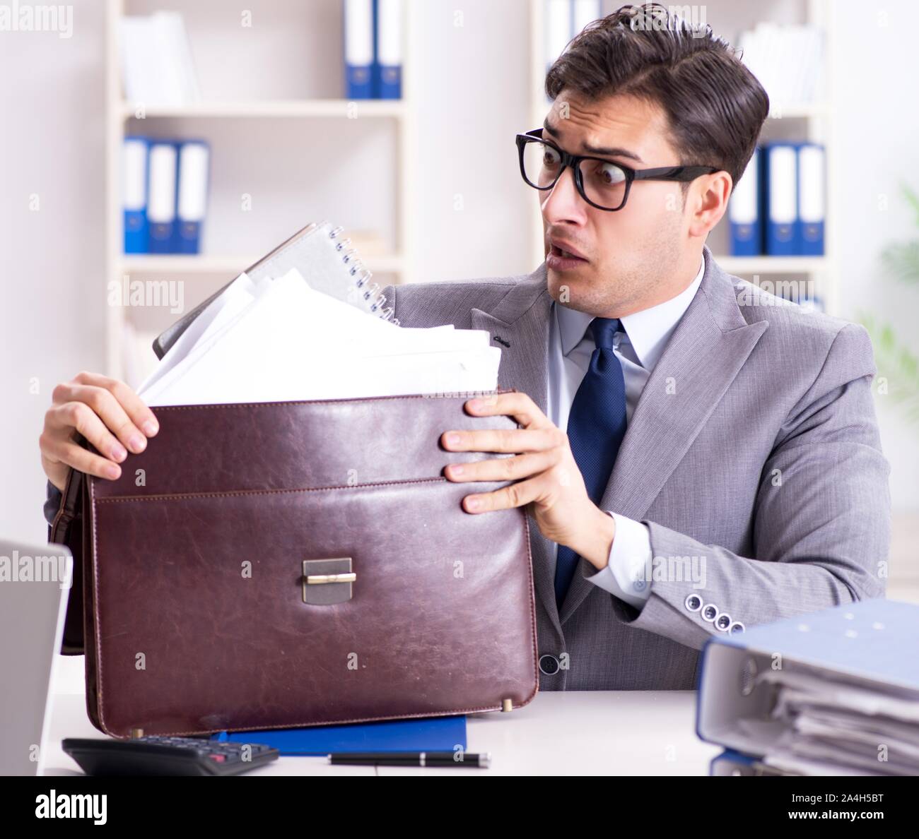 The employee with too much work taking it home Stock Photo - Alamy